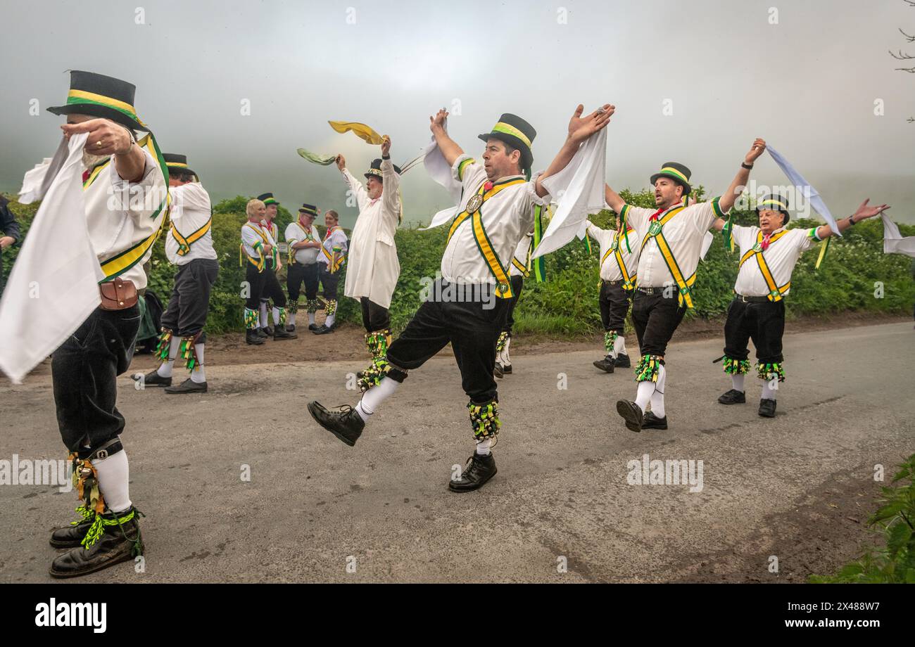 Long Man Morris Dancers perform below the Long Man of Wilmington, East ...