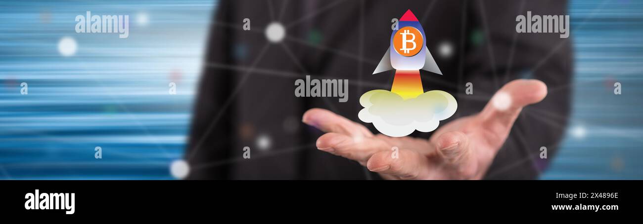 Bitcoin rise concept above the hand of a man in background Stock Photo ...