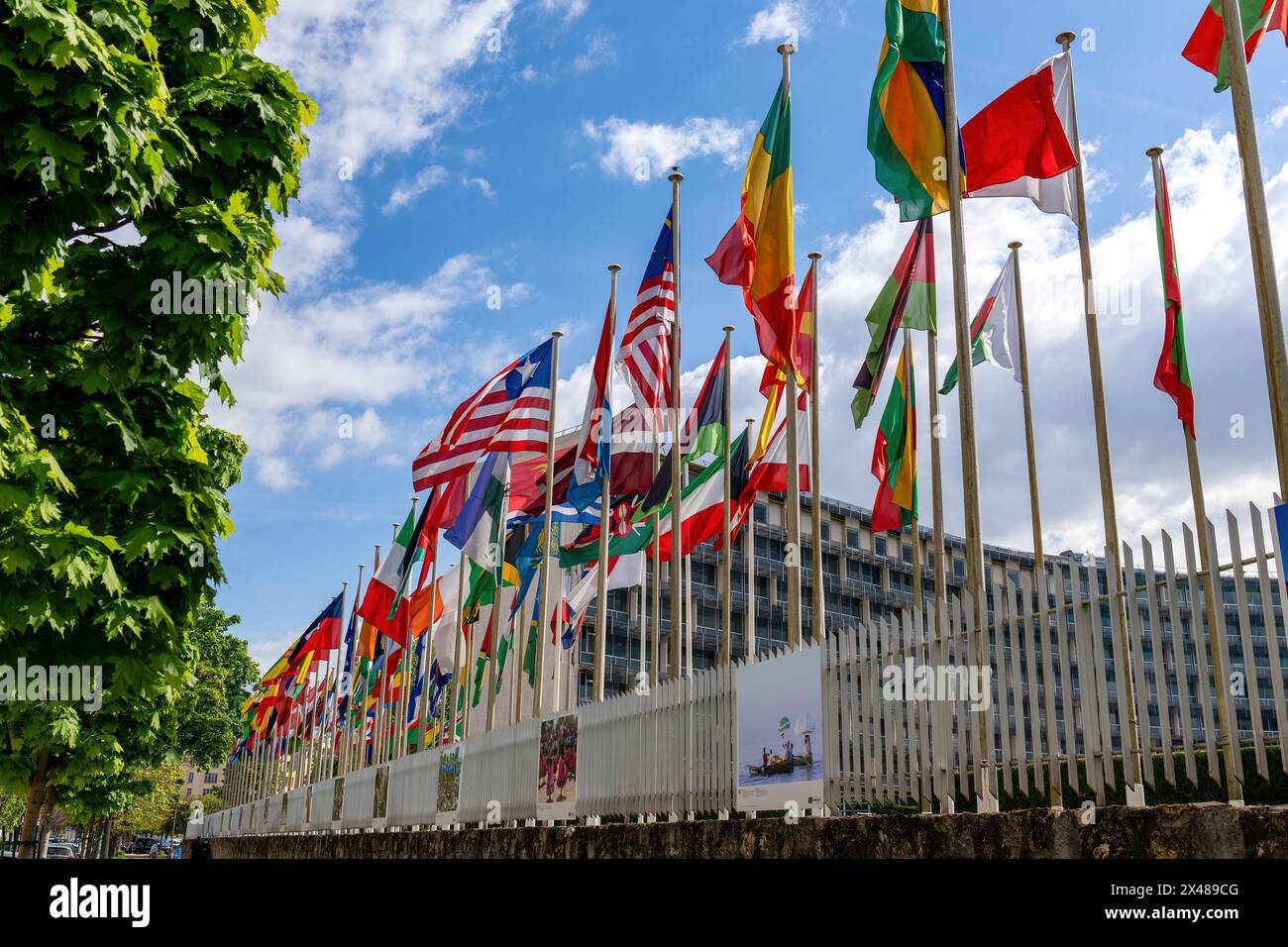 Flags fluttering in the wind in front of the UNESCO in Paris, France ...