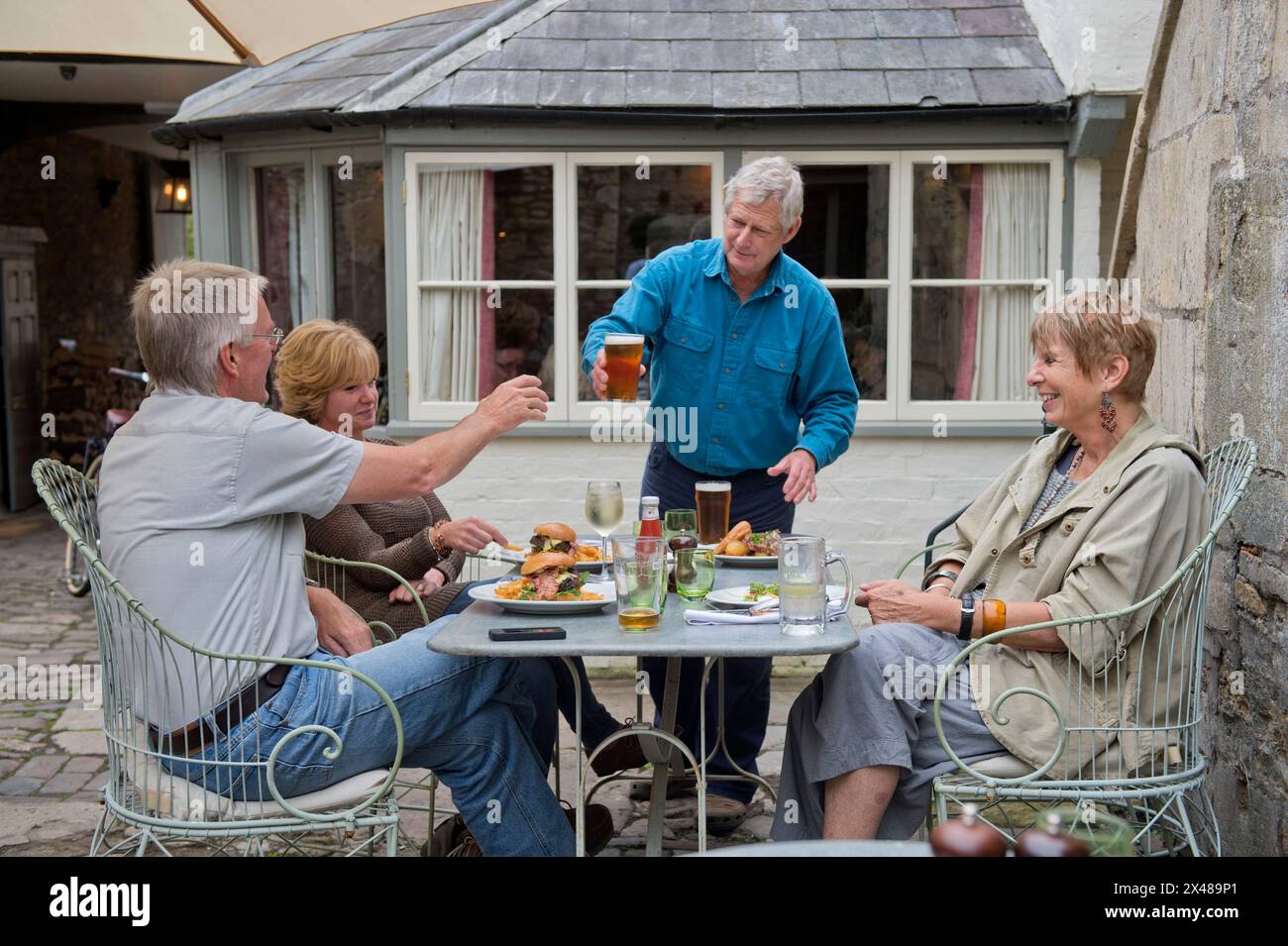 Sunday lunchtime drinks at the Talbot Inn in Mells, Somerset UK Stock ...