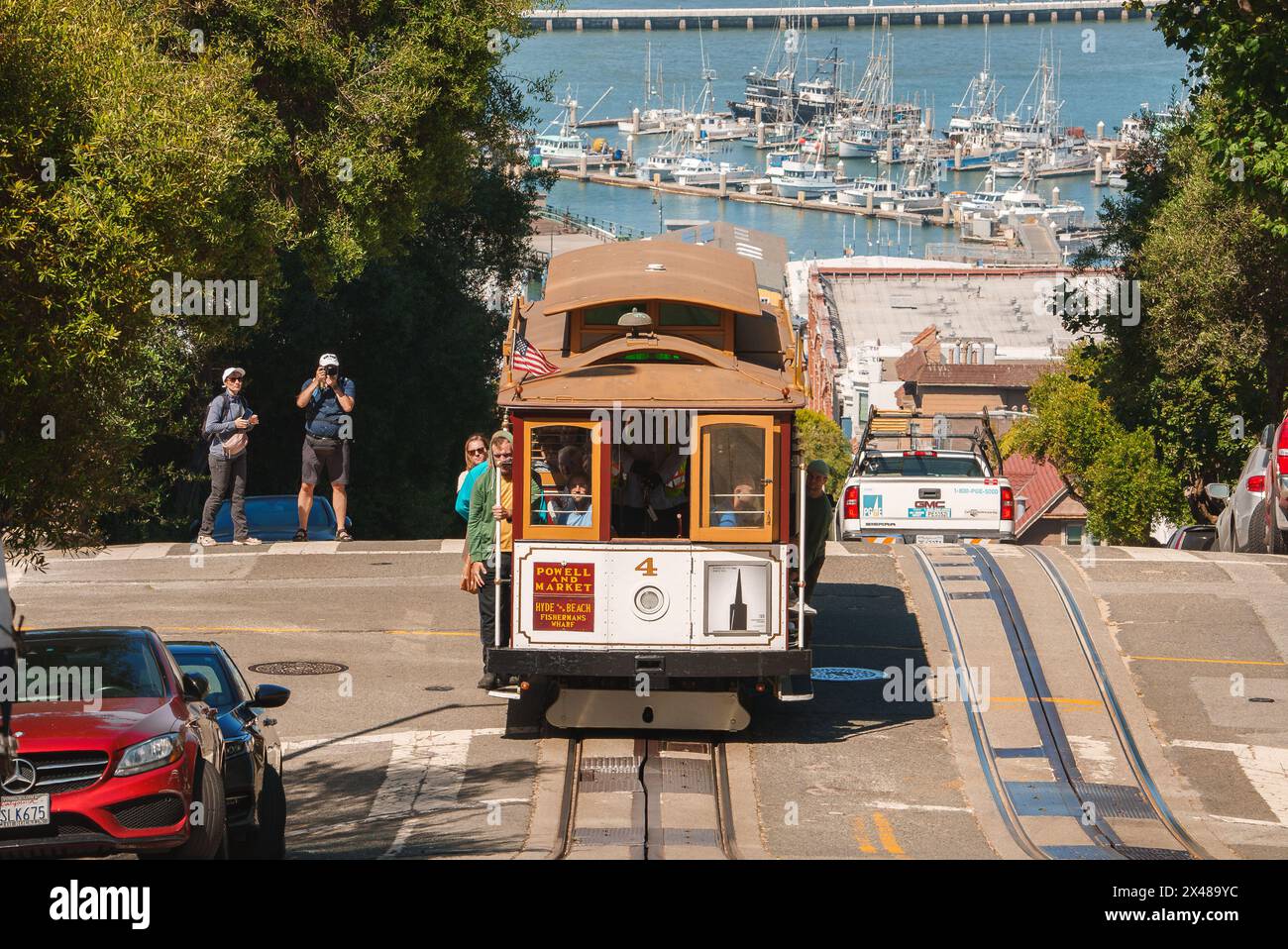 San Francisco cable car travels on steep street, by bay Stock Photo - Alamy
