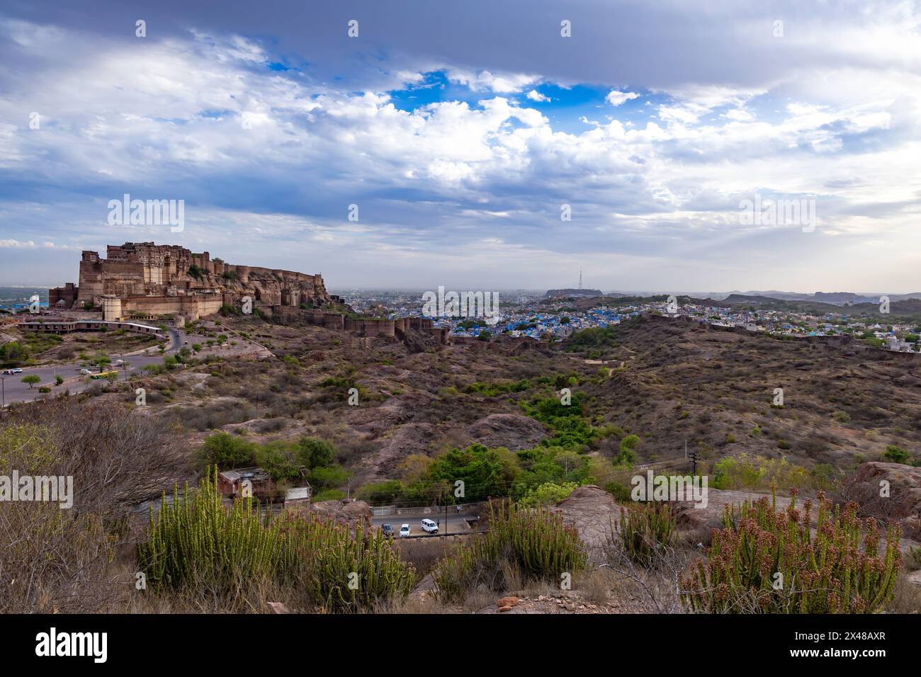 ancient historical fort with blue colored city houses and dramatic ...