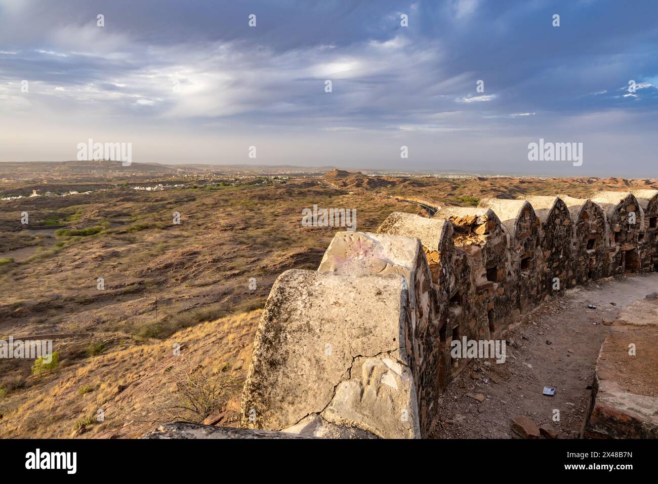ancient fort protection wall with dry mountain terrain and dramatic ...