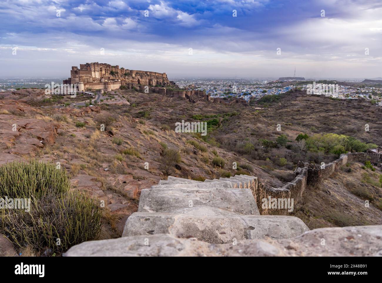 ancient historical fort with colored city houses and dramatic cloudy ...