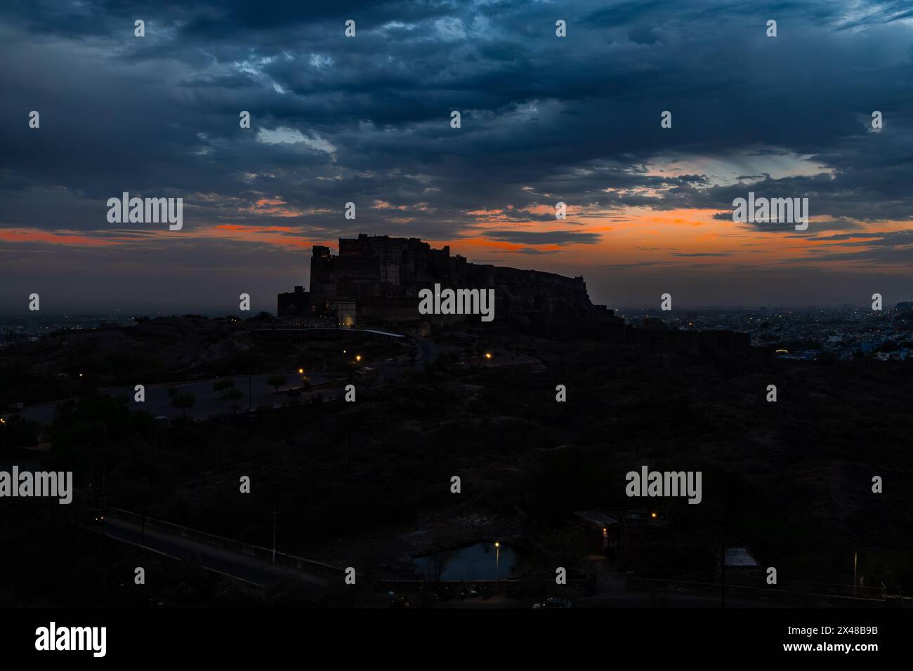 backlit shot of ancient historical fort with dramatic sunset sky at ...