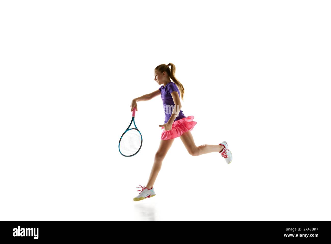Portrait of young sportive girl, teenage tennis player in uniform ...
