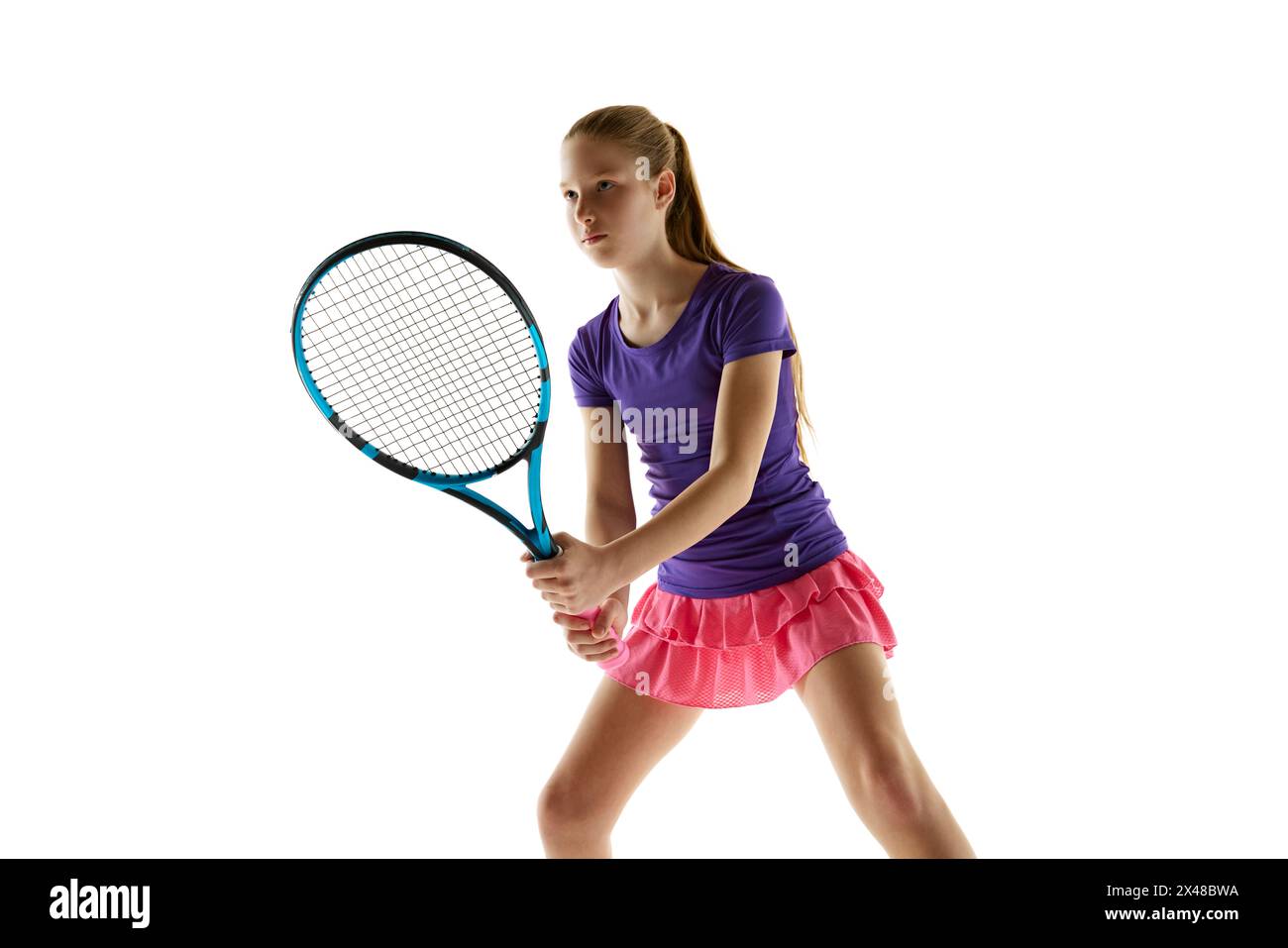 Portrait of young athletic teenage girl in vibrant uniform stand ready ...