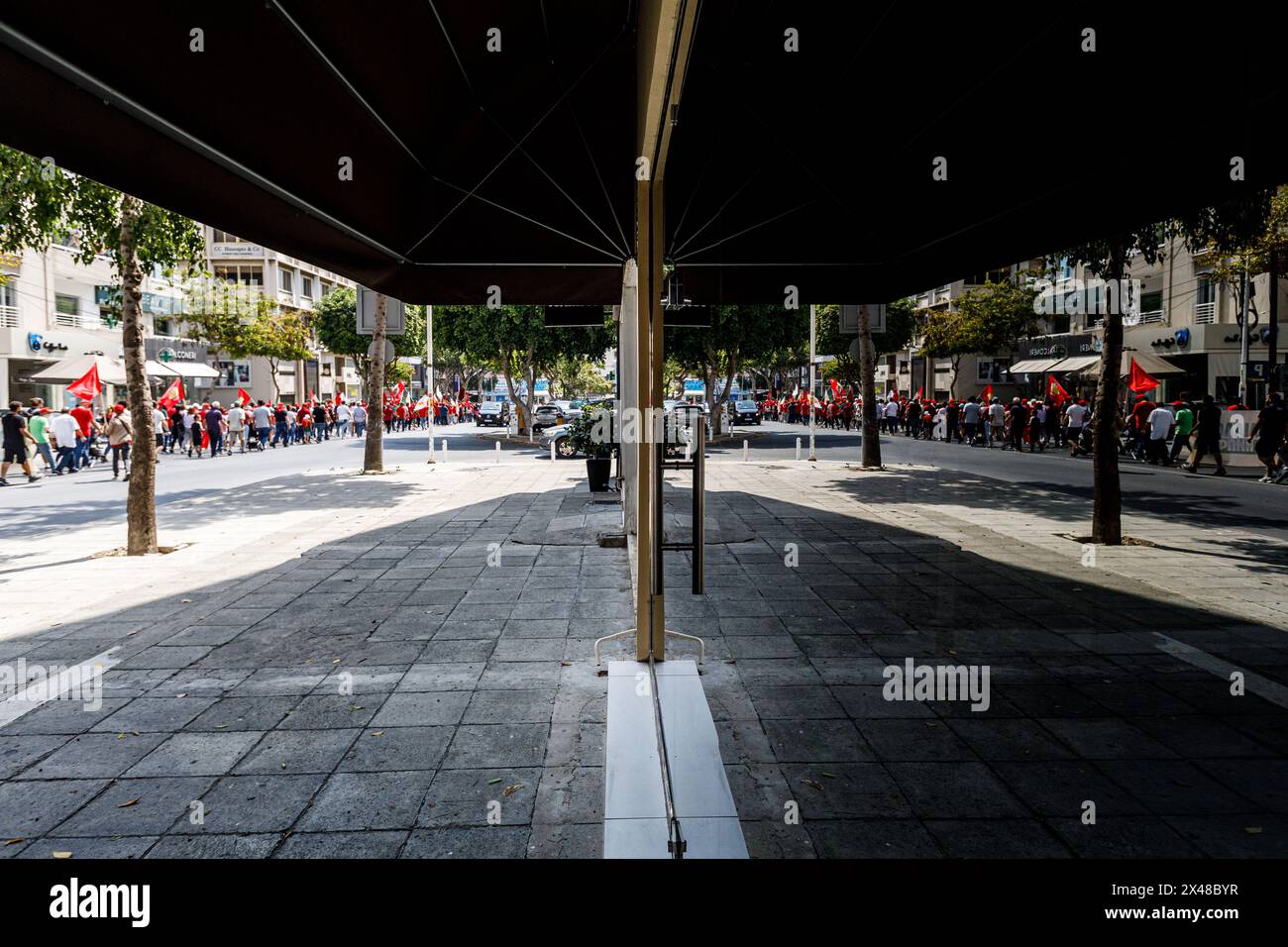 Limassol, Cyprus. 01st May, 2024. The marching people are reflected in ...