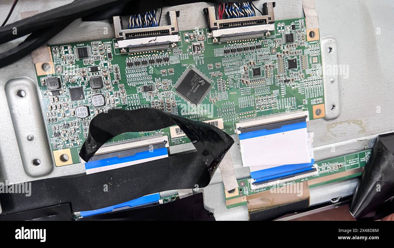 Circuit board with electronic devices attached to the top of the ...