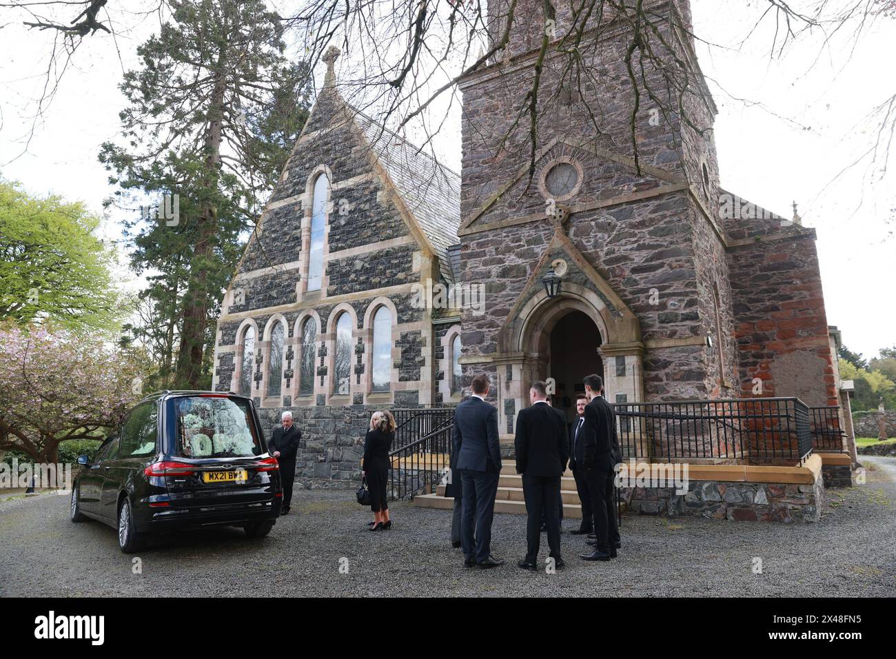 Mourners gather as the hearse carrying the coffin of former BBC ...