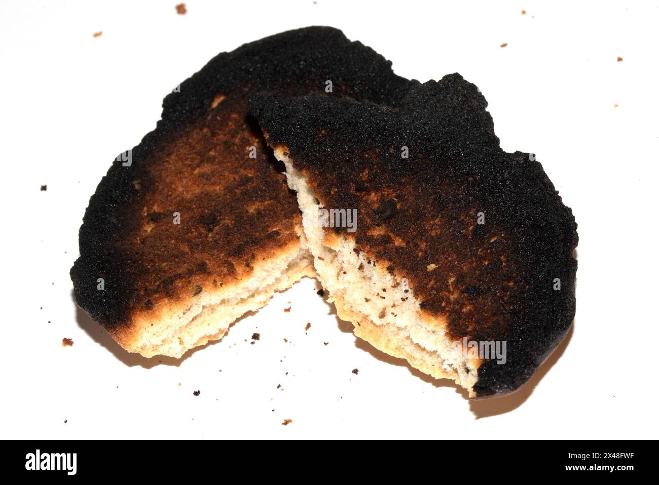 A Very Burnt Bread Roll Torn or Cut in Half Toast Close Up Texture ...