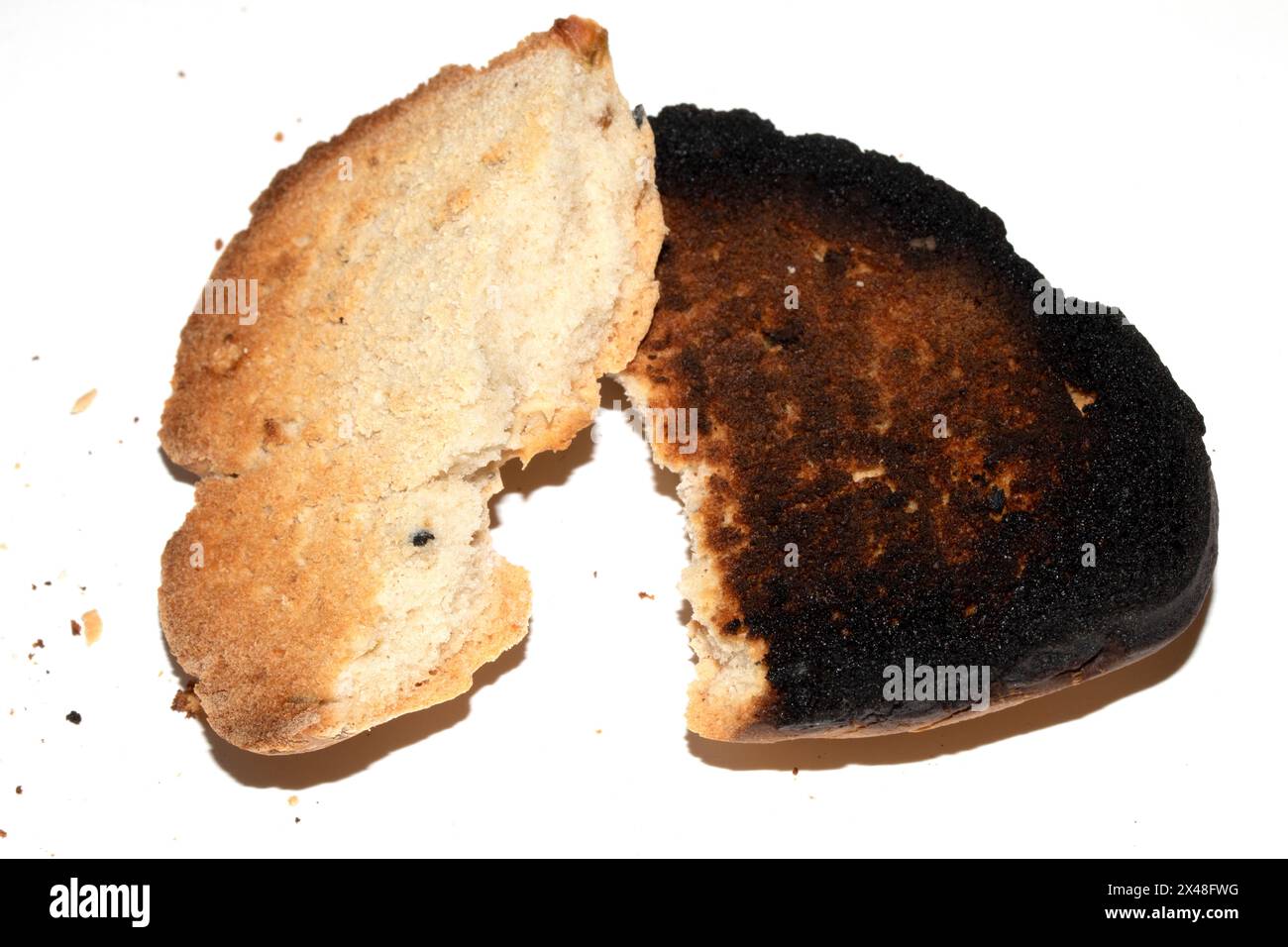 A Very Burnt Bread Roll Torn or Cut in Half Toast Close Up Texture ...
