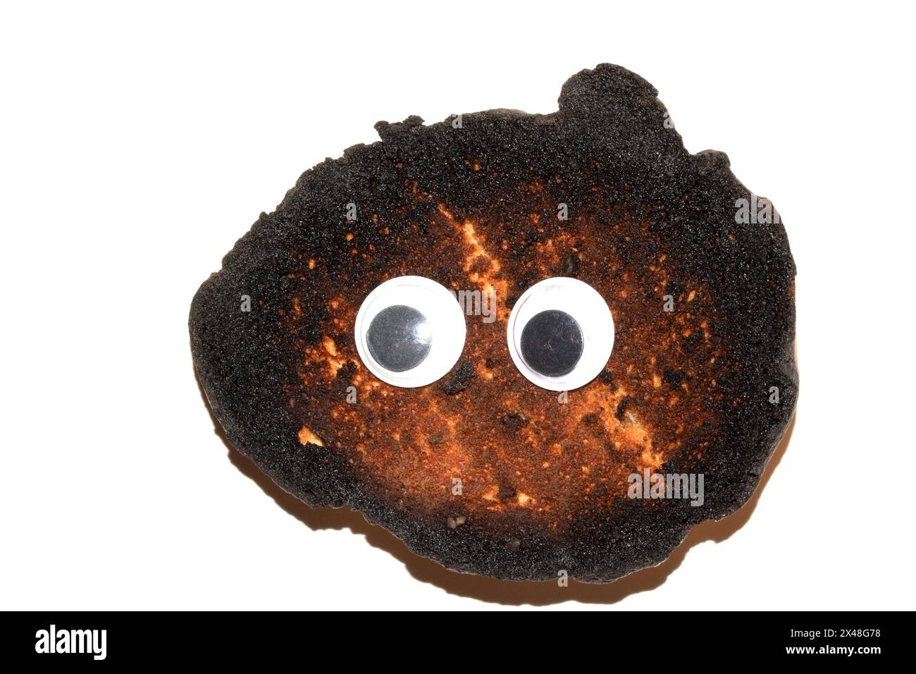 A Funny Burnt Toast Bread Roll With Googly Wobble Eyes Stock Photo - Alamy
