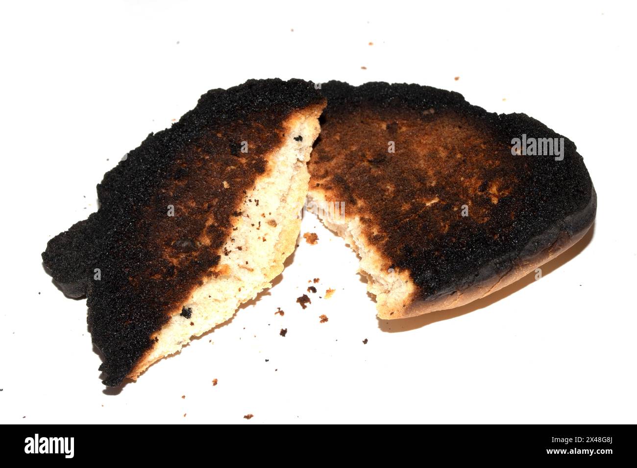 A Very Burnt Bread Roll Torn or Cut in Half Toast Close Up Texture ...
