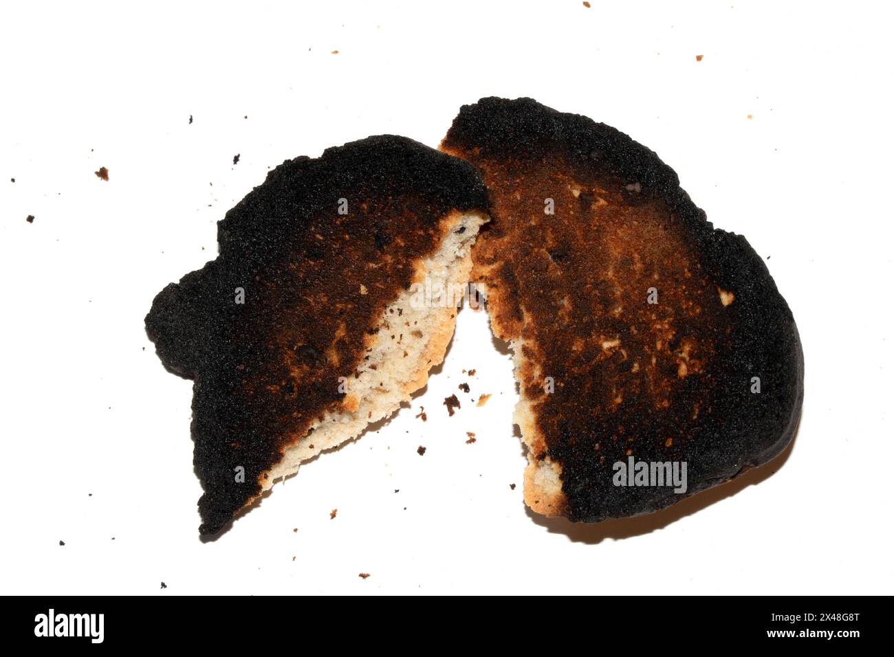 A Very Burnt Bread Roll Torn or Cut in Half Toast Close Up Texture ...