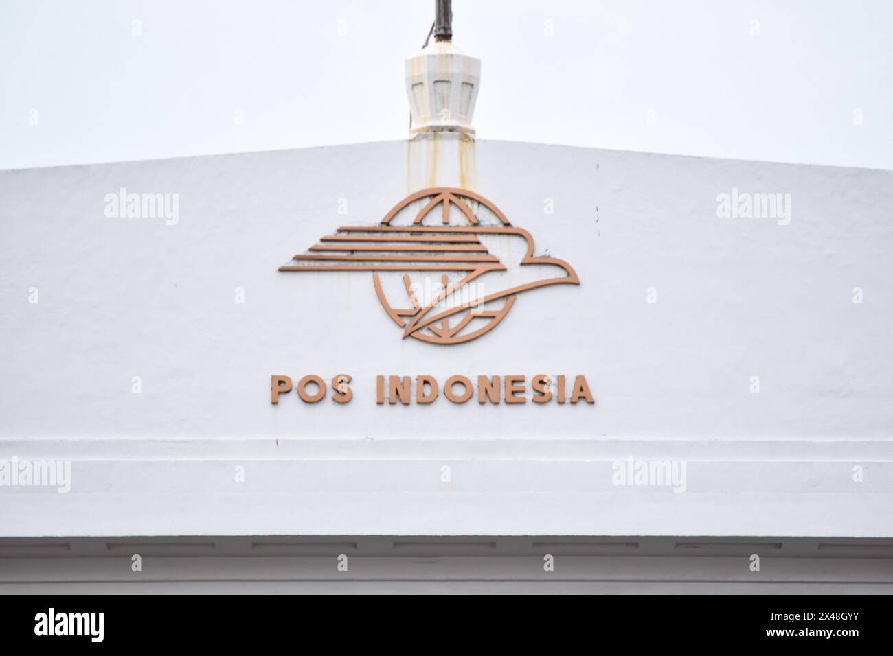 Pos Indonesia logo and sign board on top of building with Indonesian ...