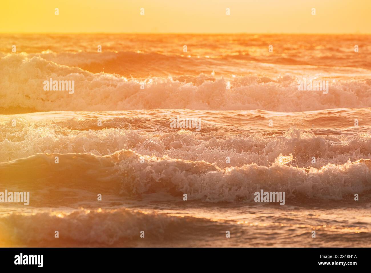 Evening sunset above sea. Riplpe sea ocean water surface with small ...