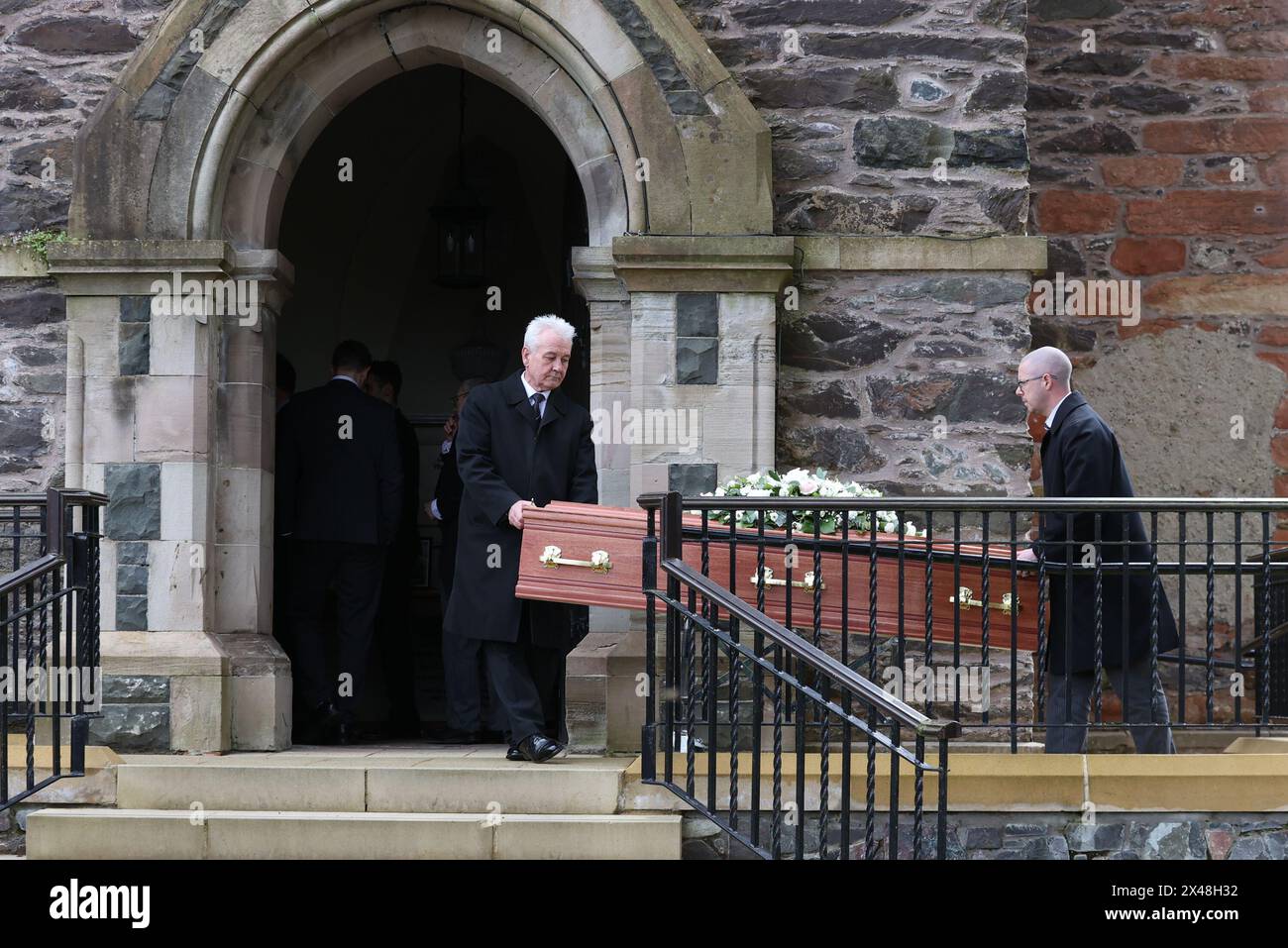 The coffin of former BBC Northern Ireland political editor and director ...