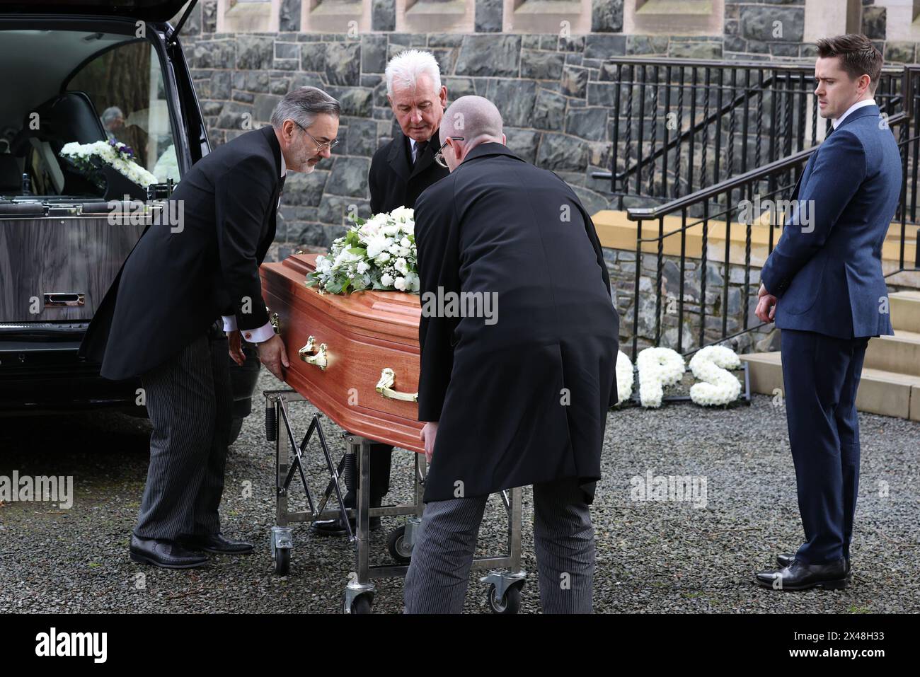 The coffin of former BBC Northern Ireland political editor and director ...