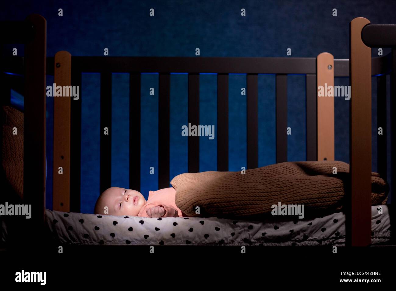 Cute little baby sleeping in cradle at home night Stock Photo - Alamy