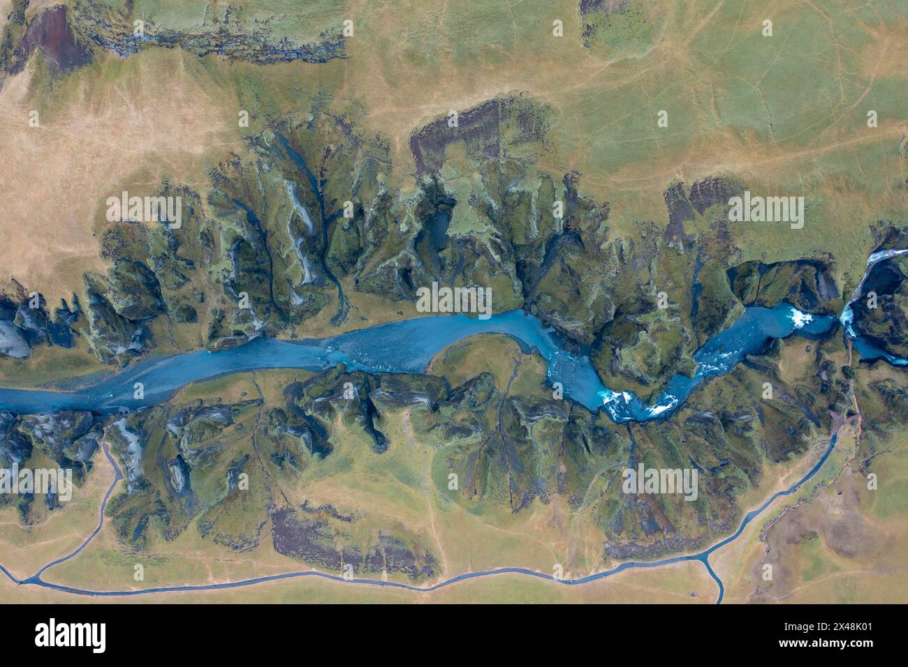 Winding blue riverbed flowing between rocks in Iceland, natural amazing ...