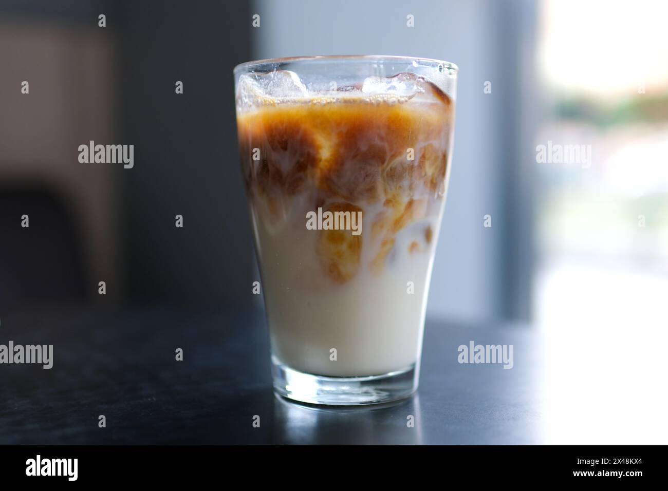 iced late in transparent glass on cafe table Stock Photo - Alamy