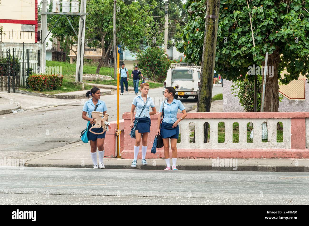 Three female Cuban students wearing uniform Stock Photo - Alamy