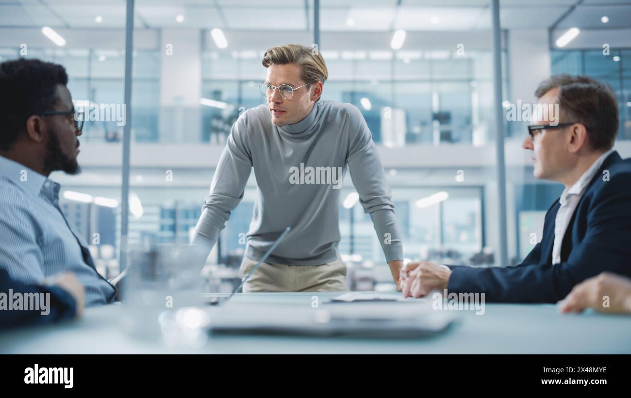 Modern Office Meeting Room: Handsome Executive Director Stands in the ...