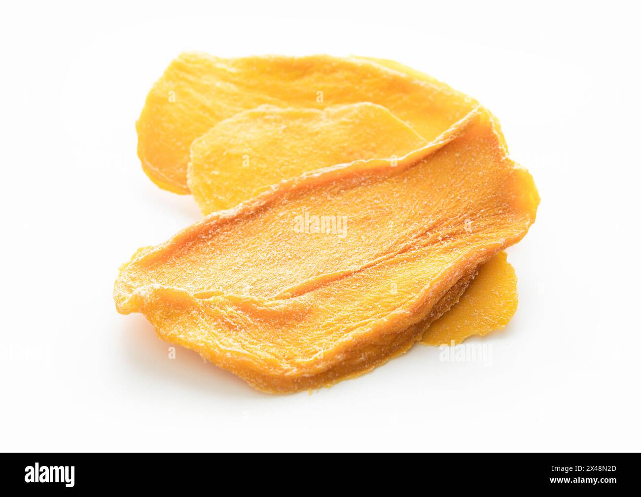 Slices of large sweet dried mangoes on white background.Mcaro Stock ...