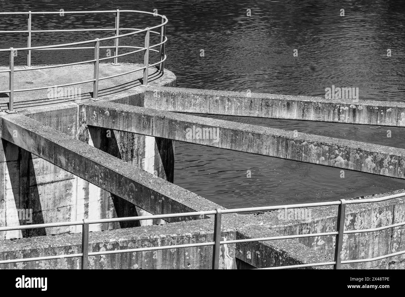 Part of concrete construction of a weir. Weathered fan shaped concrete ...