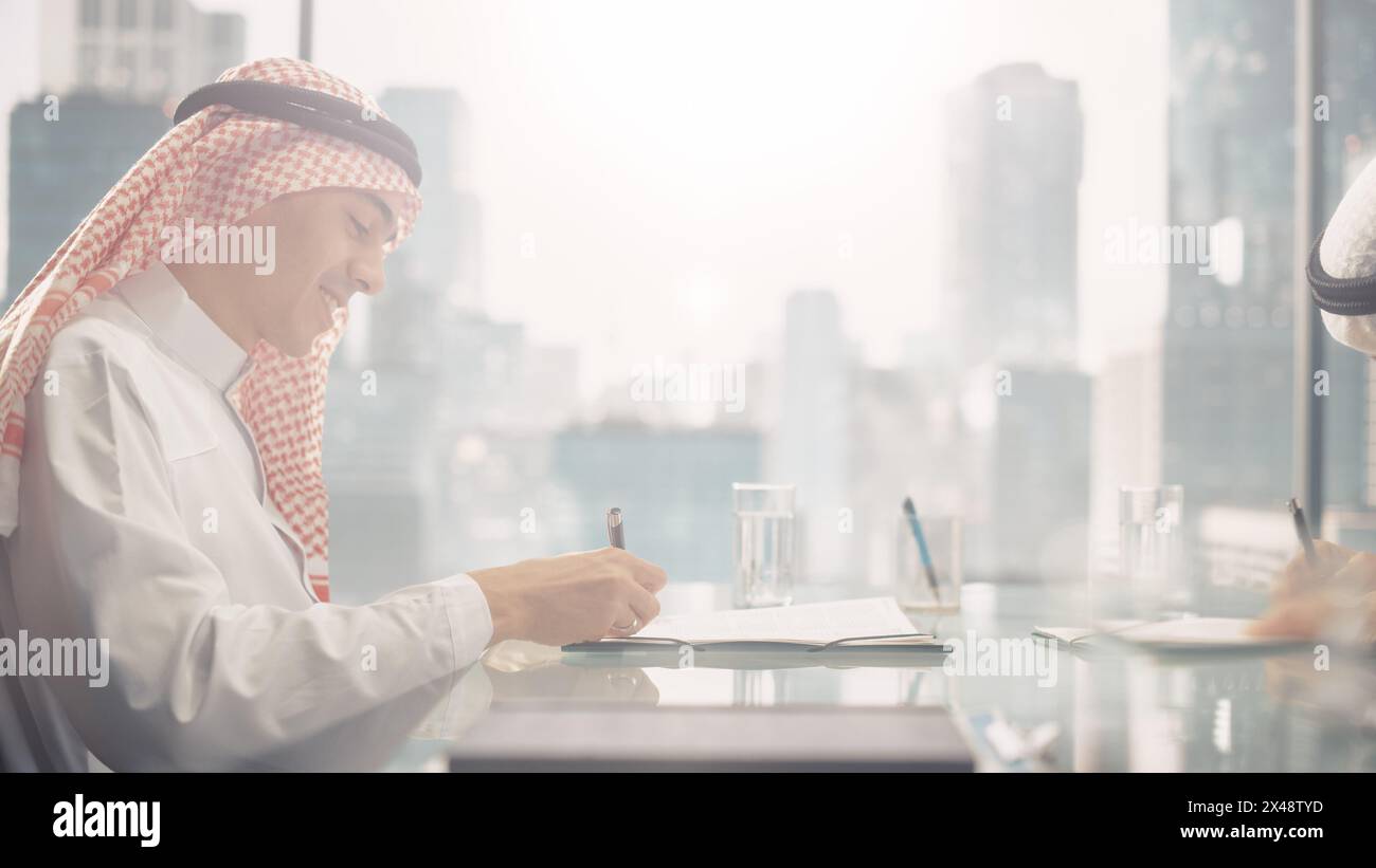 Two Successful Emirati Businessmen in White Traditional Outfit Sitting ...