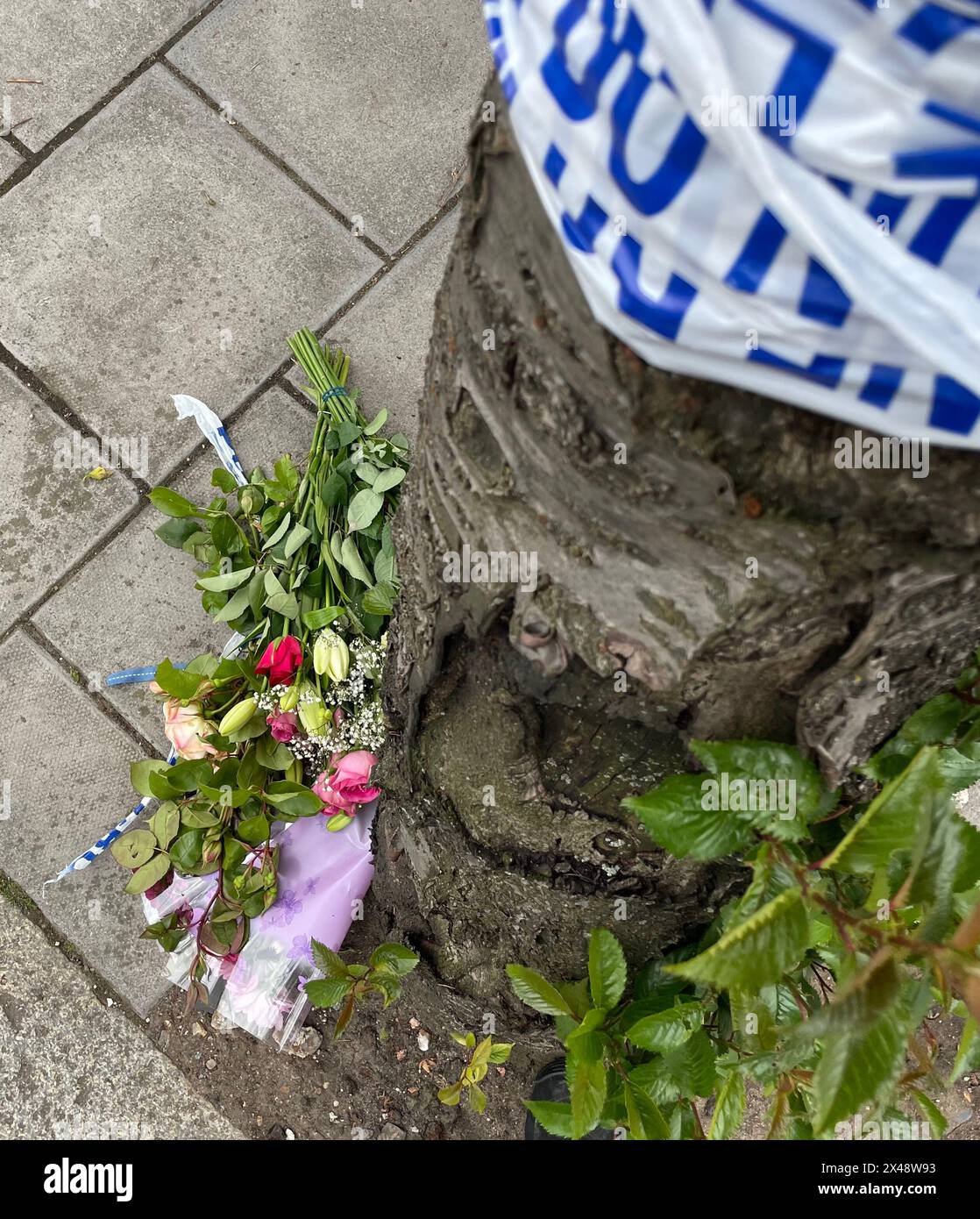 Floral tributes left near the police cordon in Hainault, north east ...
