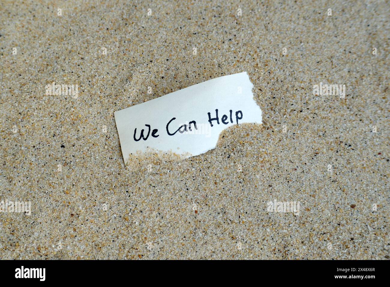 We can help handwritten text on turn paper Stock Photo - Alamy