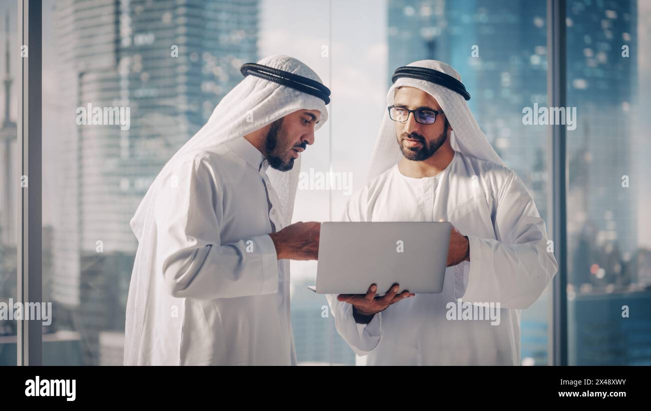 Two Successful Muslim Businessmen in White Traditional Outfit Standing ...