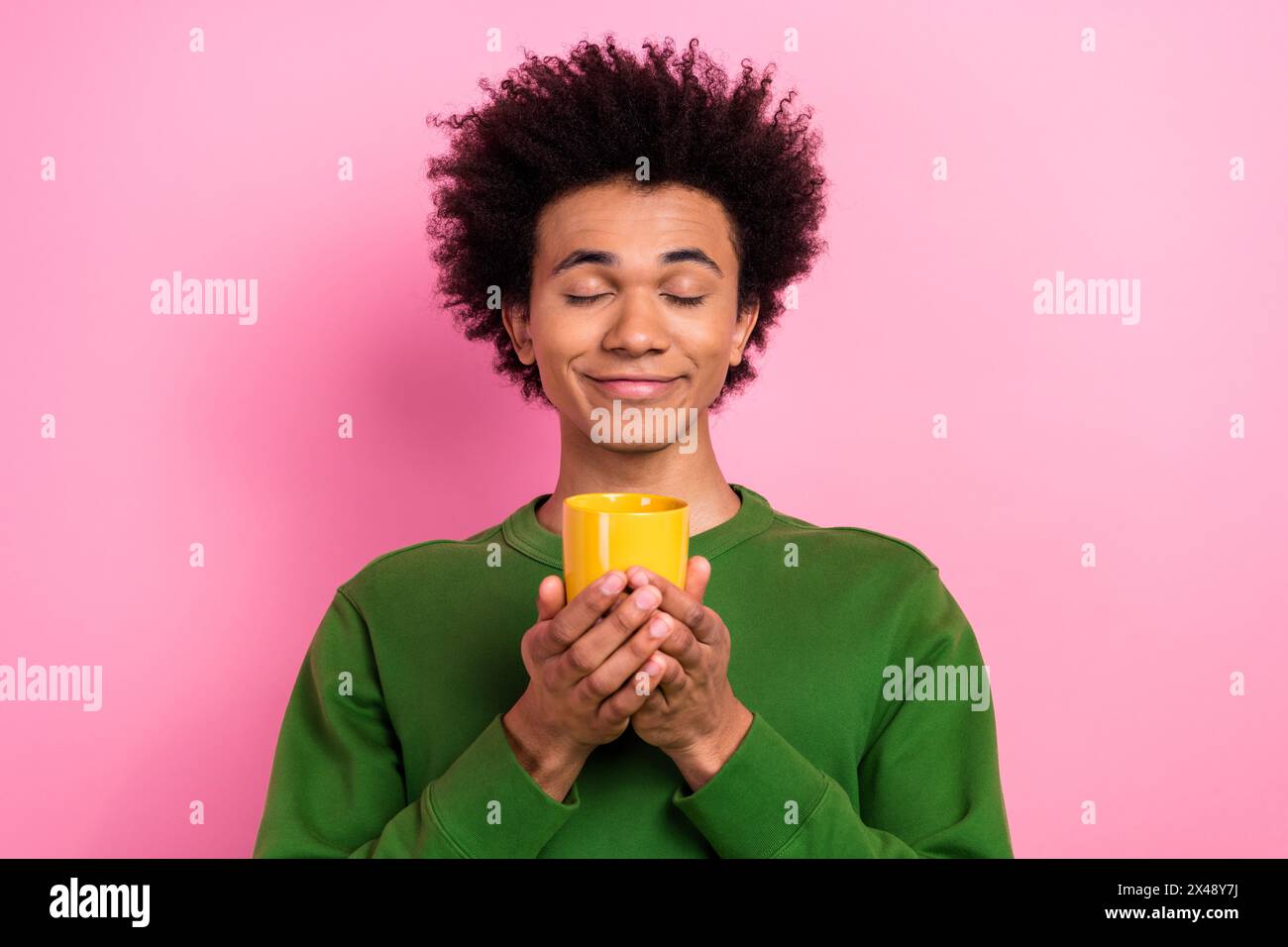 Photo of happy positive guy smell aroma coffee cup enjoy flavor ...
