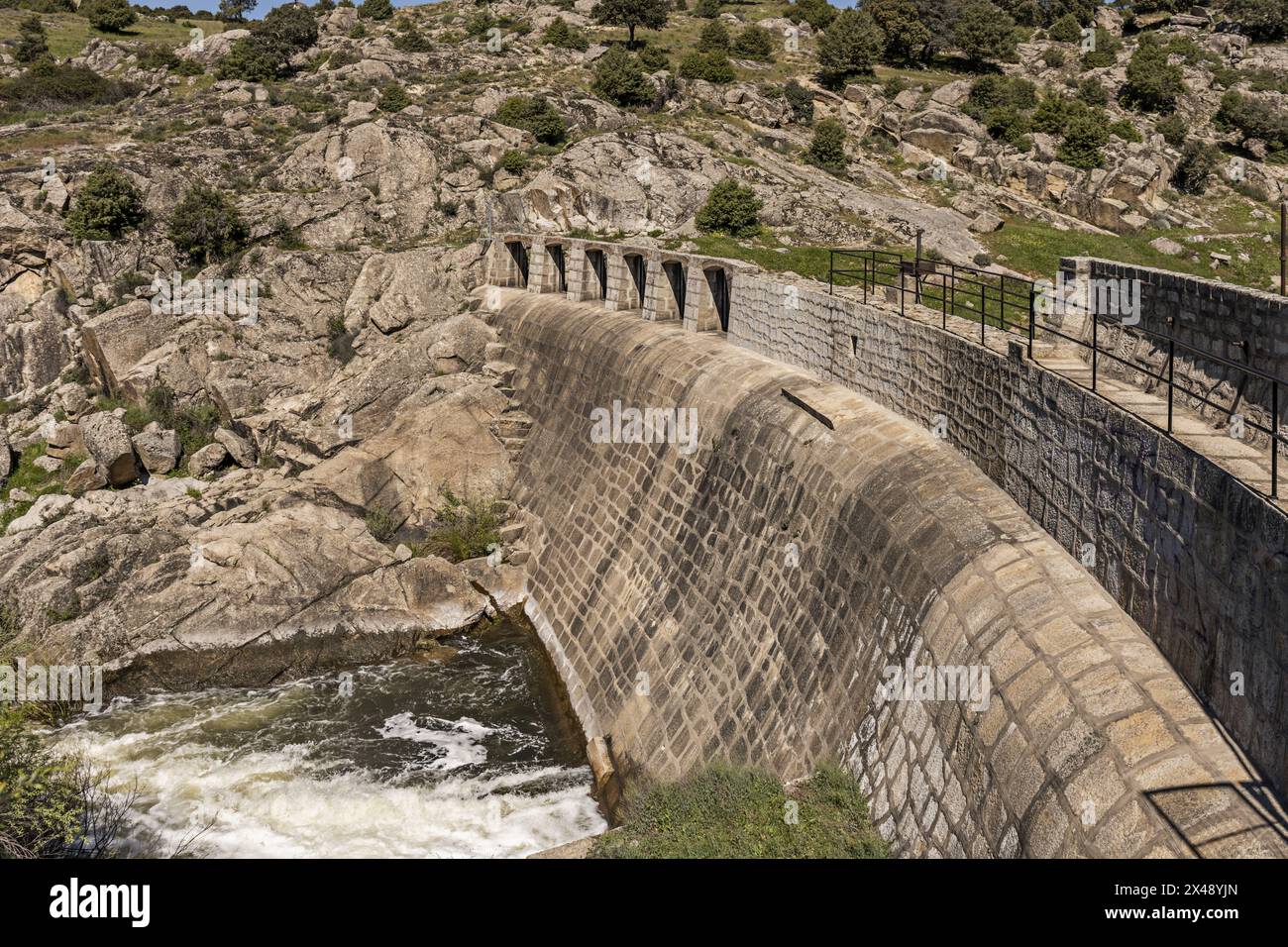 A small dam in the middle of a granite rock mountain Stock Photo - Alamy