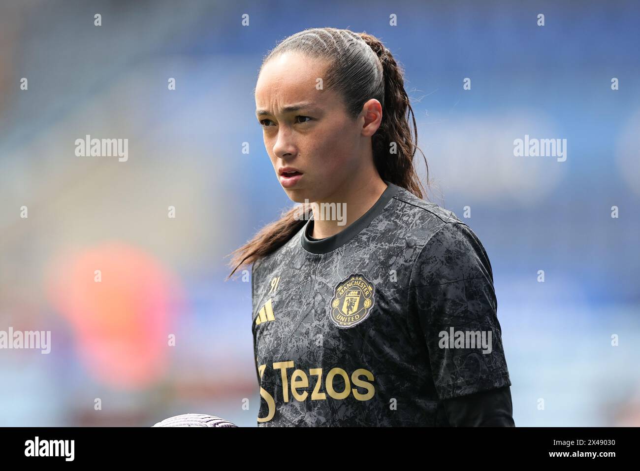 Phallon Tullis-Joyce of Manchester United warms up ahead of the ...