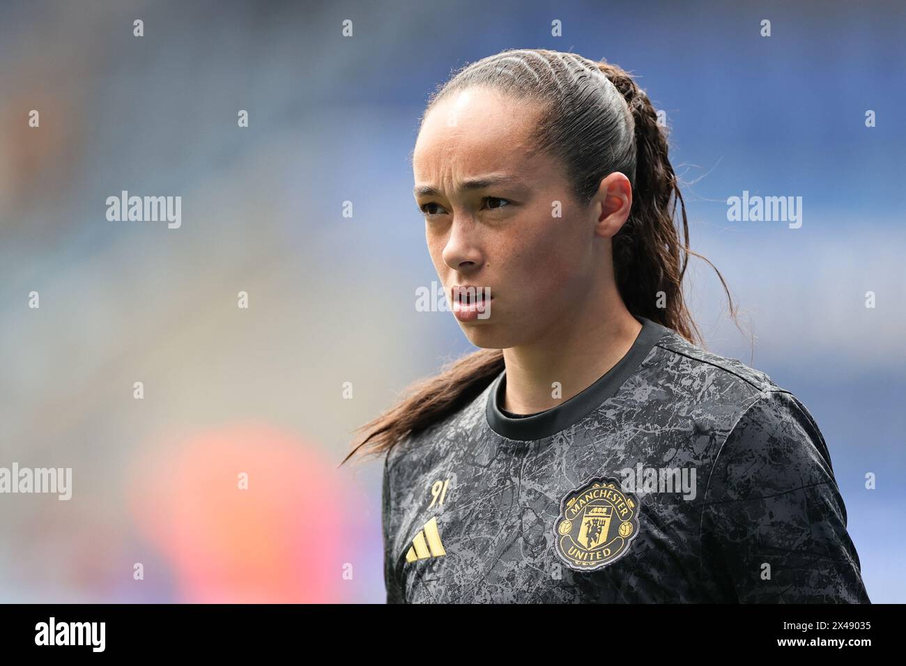 Phallon Tullis-Joyce of Manchester United warms up ahead of the ...