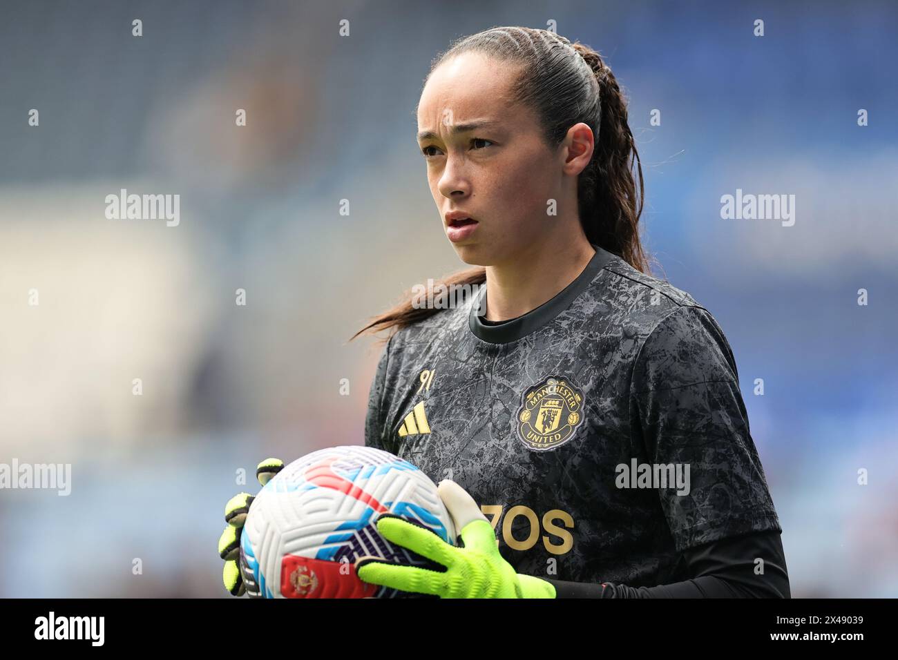 Phallon Tullis-Joyce of Manchester United warms up ahead of the ...