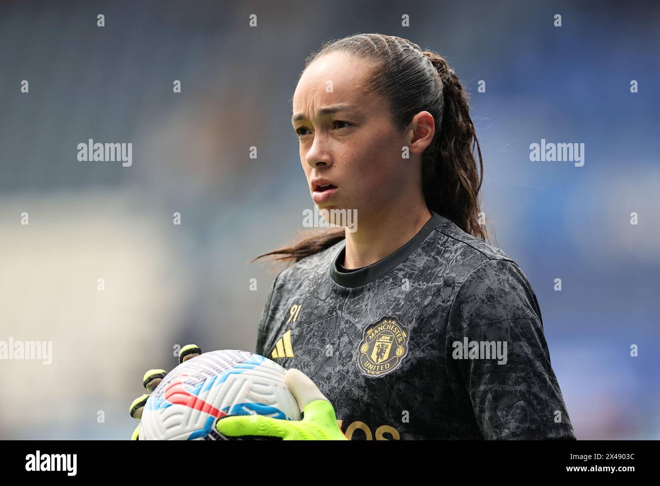 Phallon Tullis-Joyce of Manchester United warms up ahead of the ...