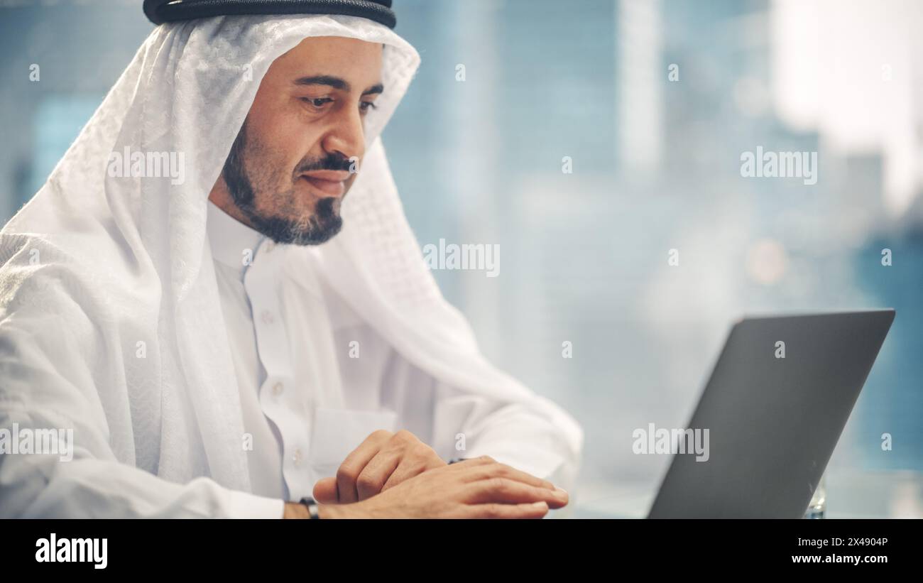 Arab Businessman in White Traditional Outfit Sitting in Office and ...