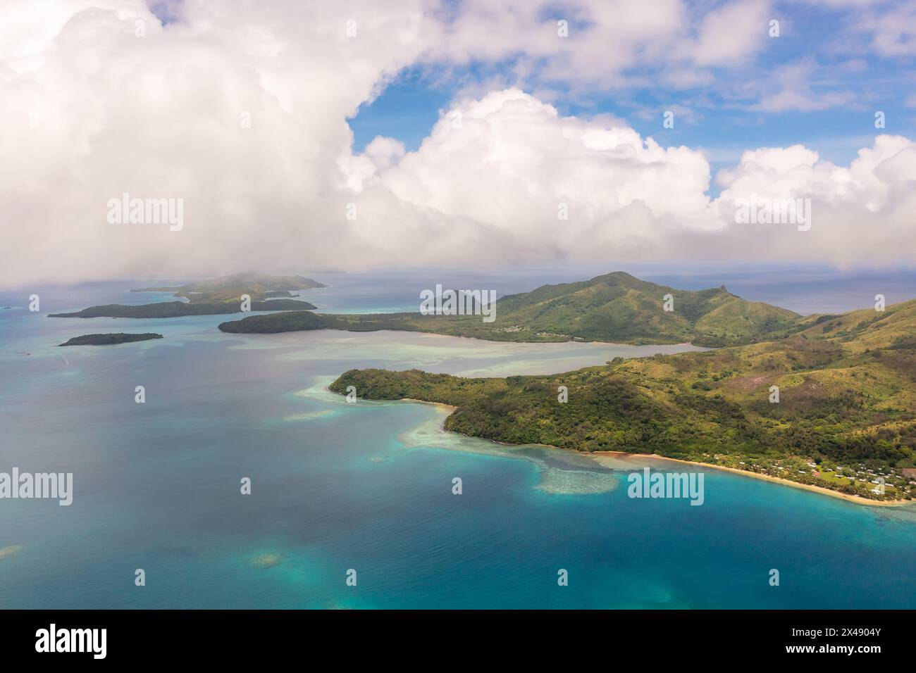 Fiji Islands. Turquoise waters of ocean wash island covered tropical ...