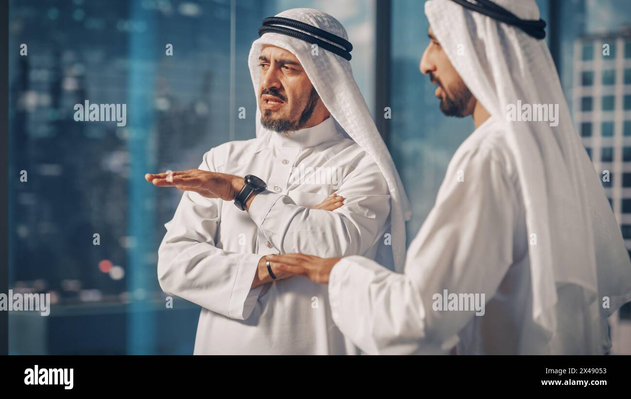 Two Successful Muslim Businessmen in White Traditional Outfit Standing ...