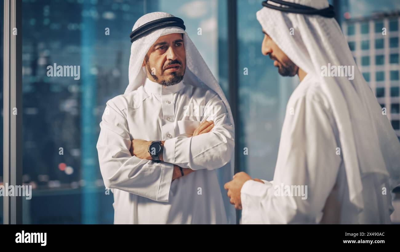 Two Successful Muslim Businessmen in White Traditional Outfit Standing ...