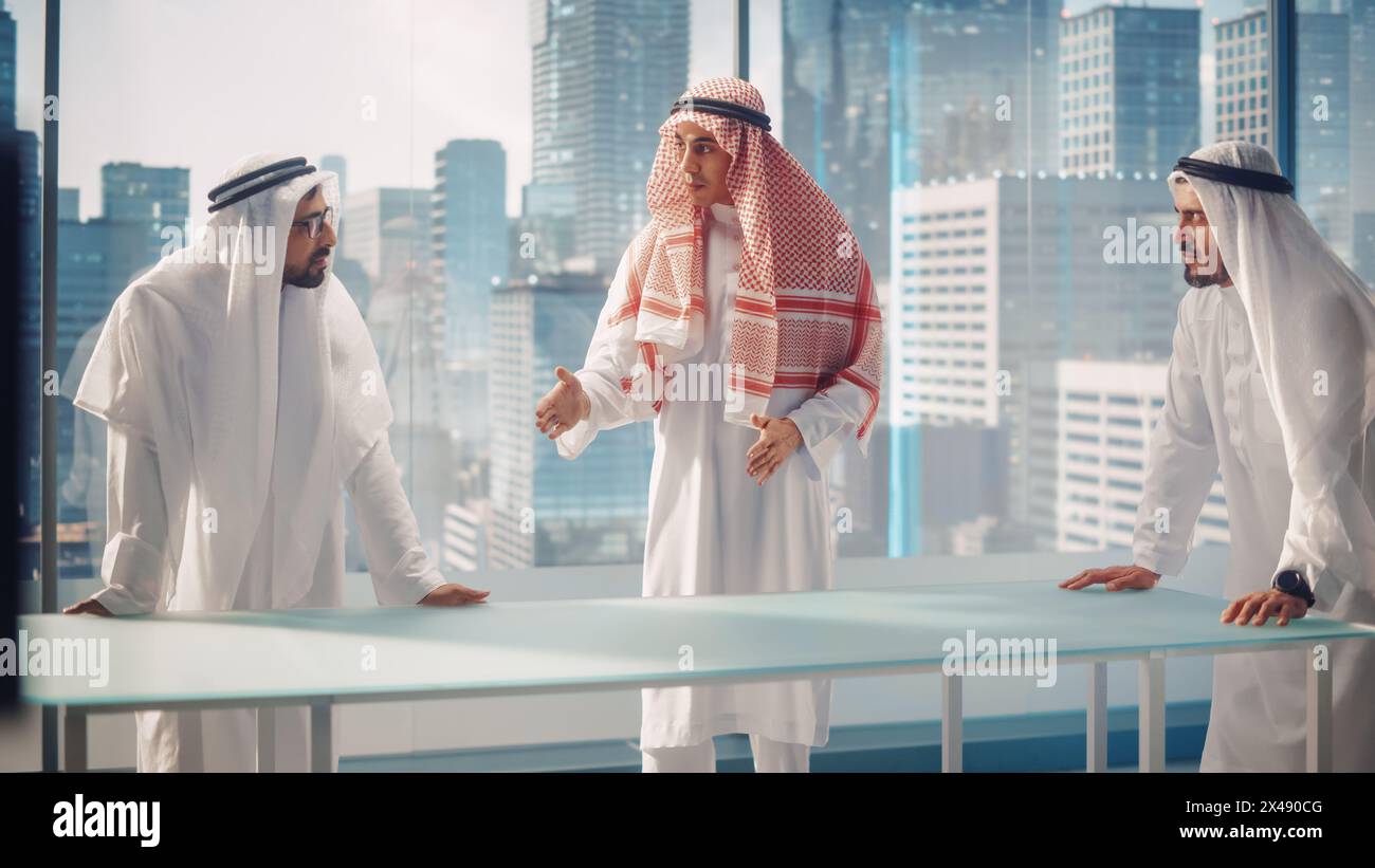 Three Successful Emirati Businessmen in White Traditional Kandura in ...