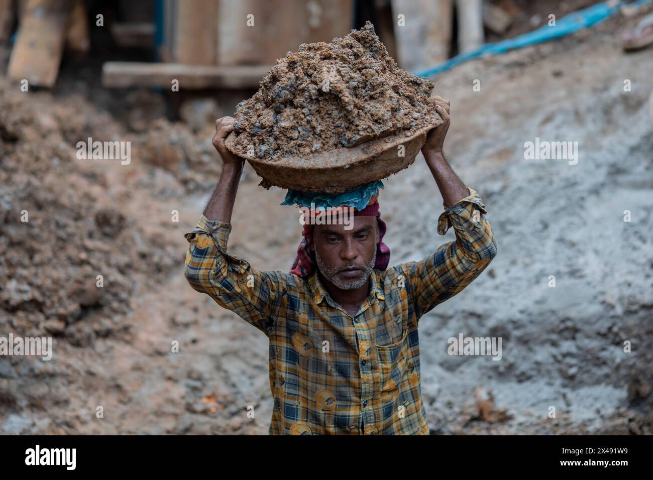 Dhaka, Bangladesh. 01st May, 2024. A labourer seen working at a ...
