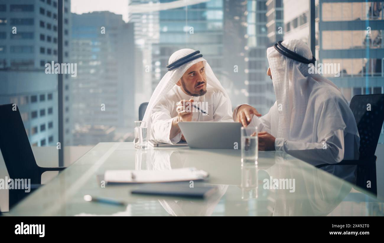 Two Successful Emirati Businessmen in White Traditional Kandura Sitting ...