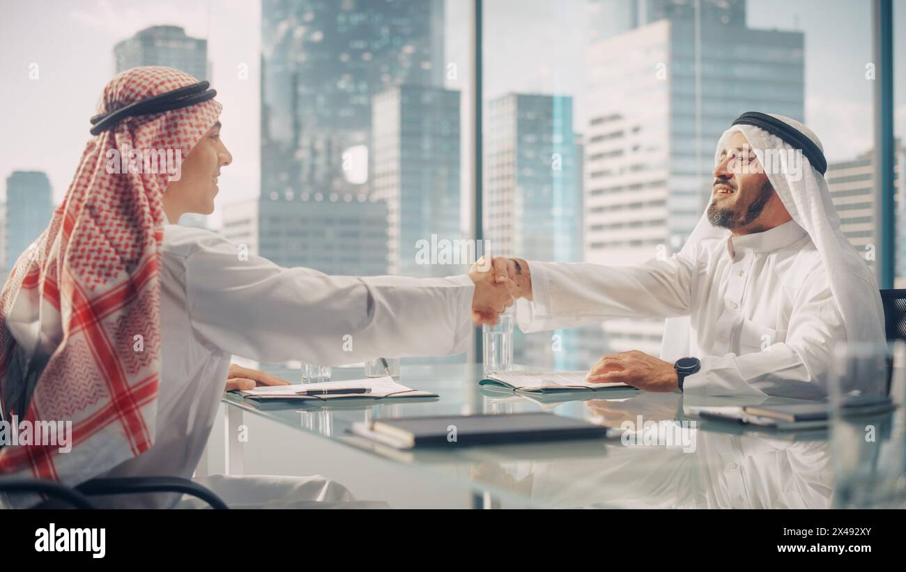 Saudi emirati arab businessmen shake hi-res stock photography and ...