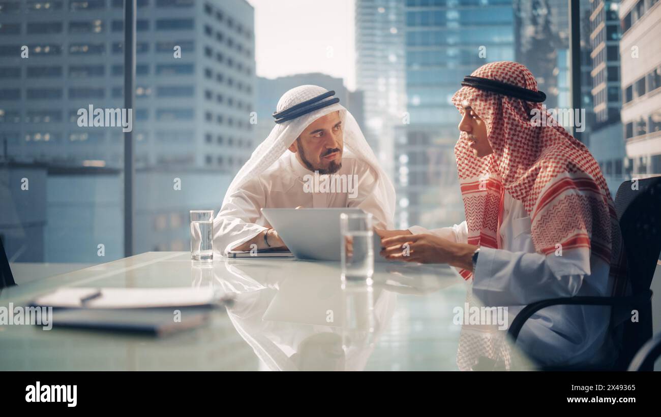 Two Successful Emirati Businessmen in White Traditional Kandura Sitting ...