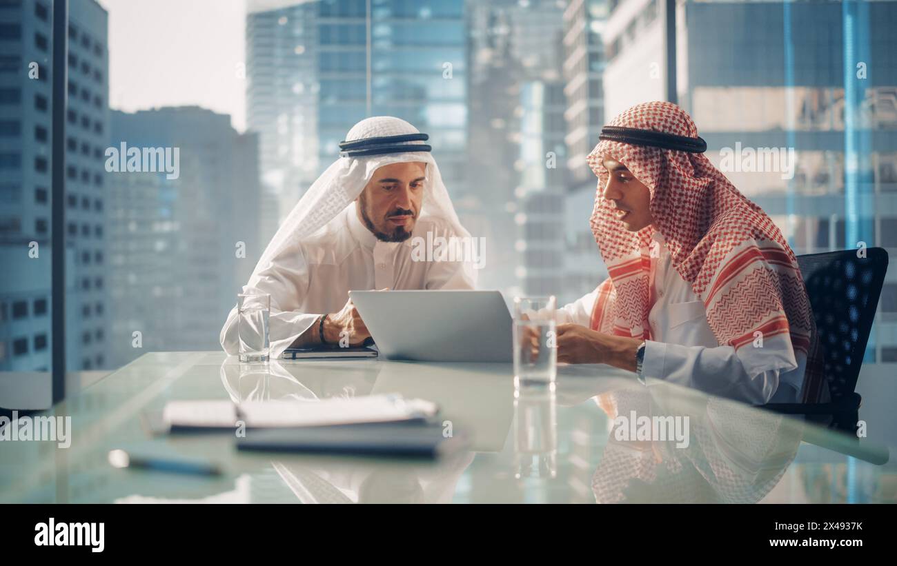 Two Successful Emirati Businessmen in White Traditional Kandura Sitting ...